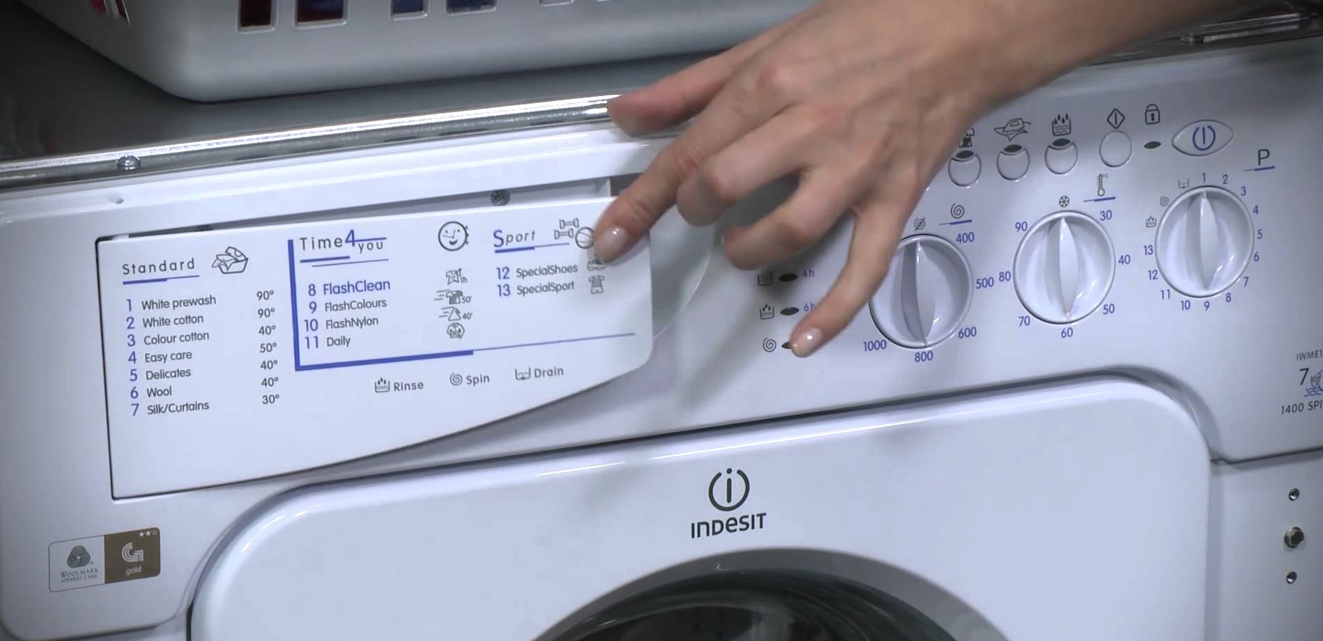 How to remove the control panel on an Indesit washing machine